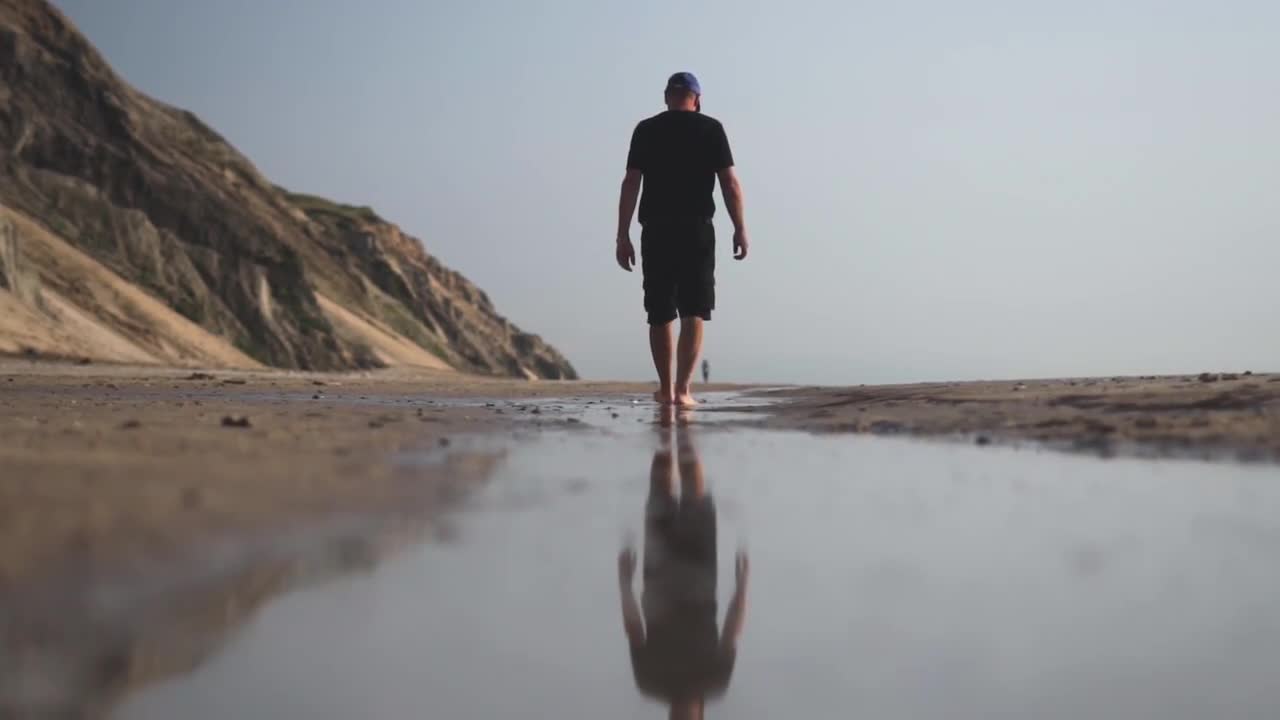 Man Walking Barefoot Through Seawater - Stock Video | Motion Array