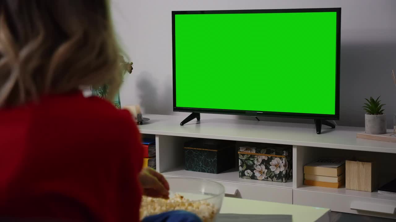 Watching A Green Screen TV - Stock Video | Motion Array