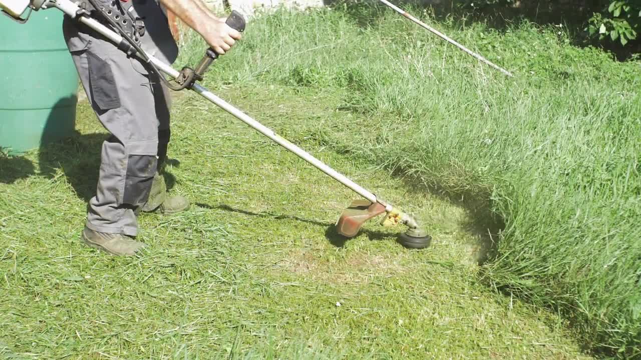 Trimming The Garden Grass - Stock Video | Motion Array