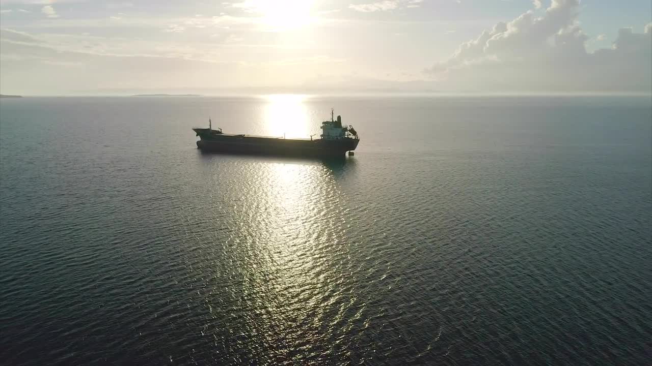 Cargo Ship At Sunset - Stock Video | Motion Array