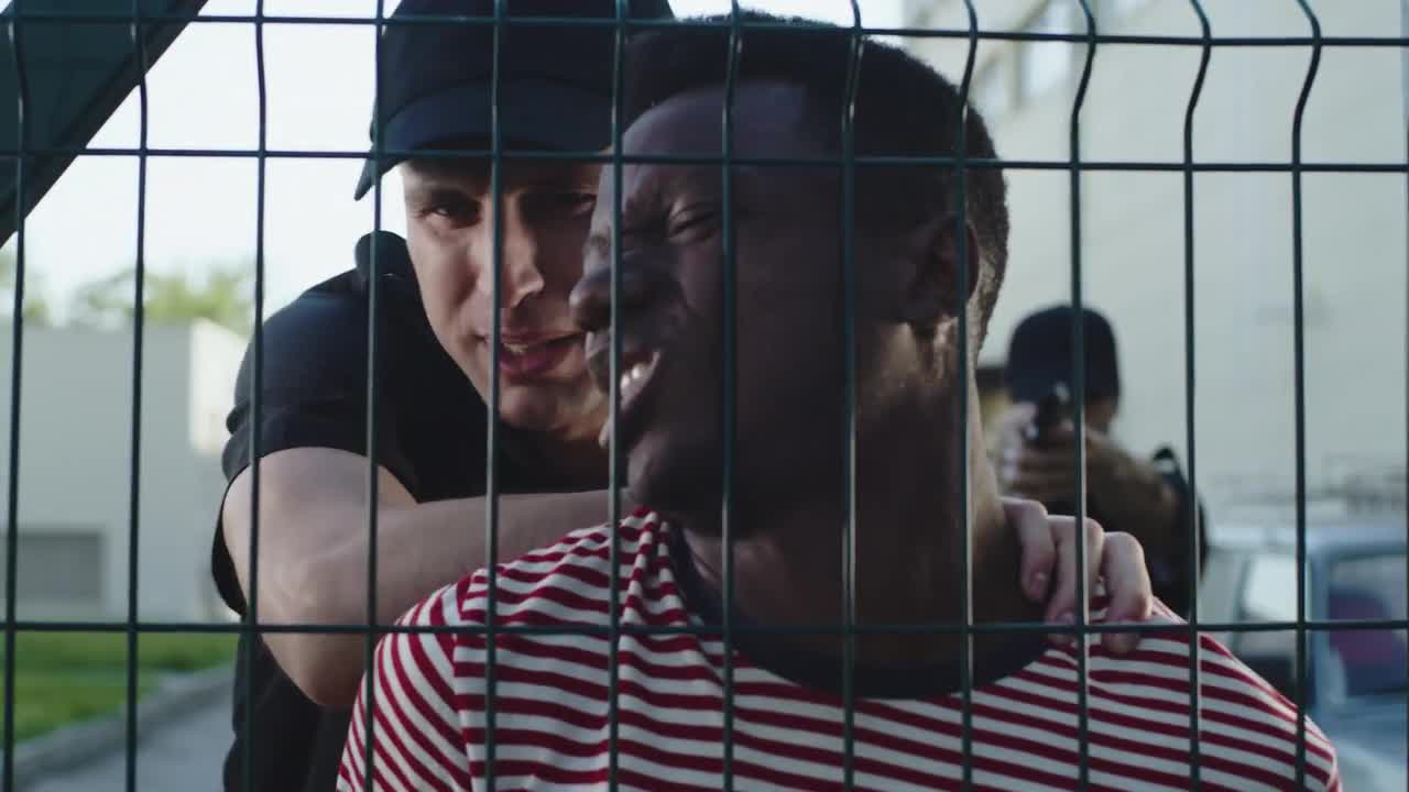 Aggressive Police Officer Arresting Man - Stock Video | Motion Array