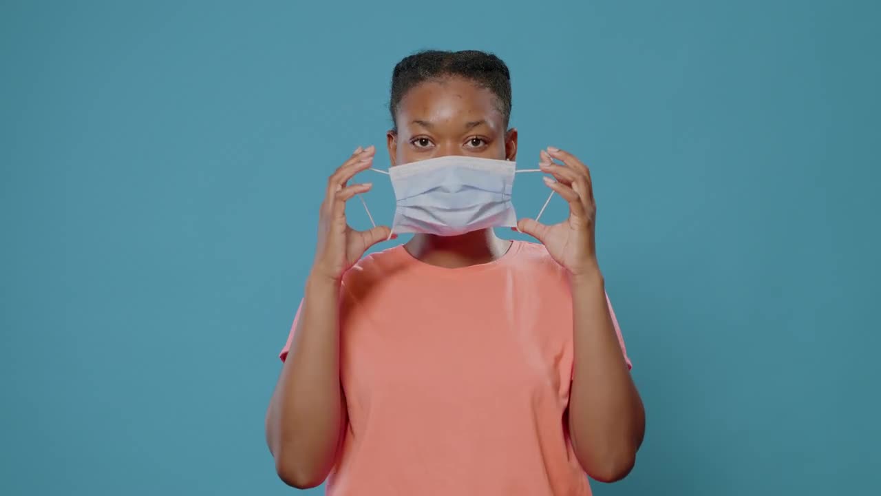 Woman Taking Off Face Mask - Stock Video | Motion Array