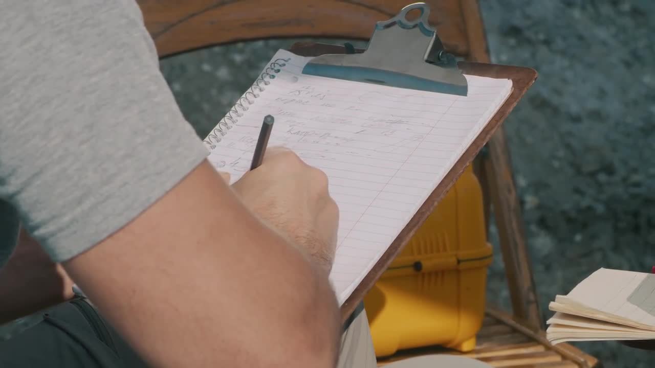 An Archaeologist Making Notes - Stock Video | Motion Array