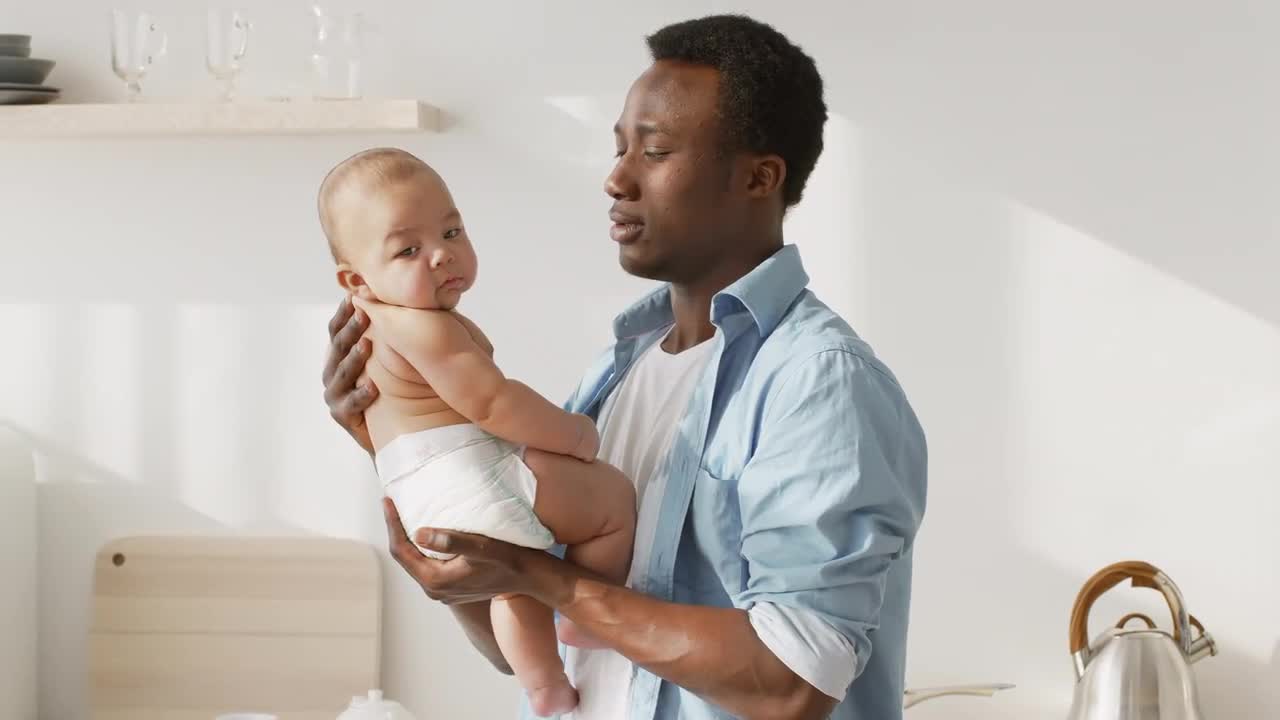 Father Rocking Baby - Stock Video | Motion Array