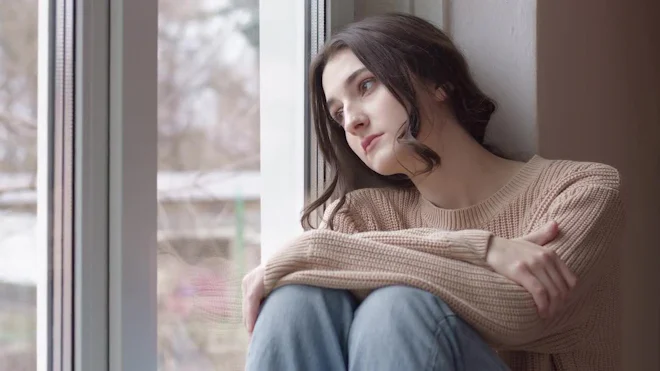Sad Woman Looking Out Window