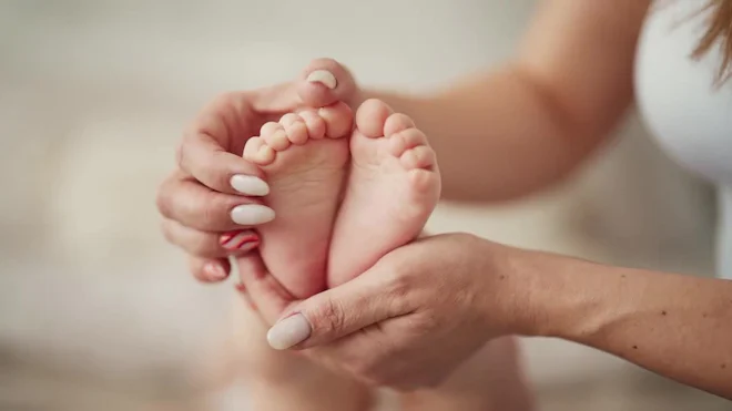 Mom Gently Tickling Baby's Feet by Sergey Grbanoff - Stock Video ...