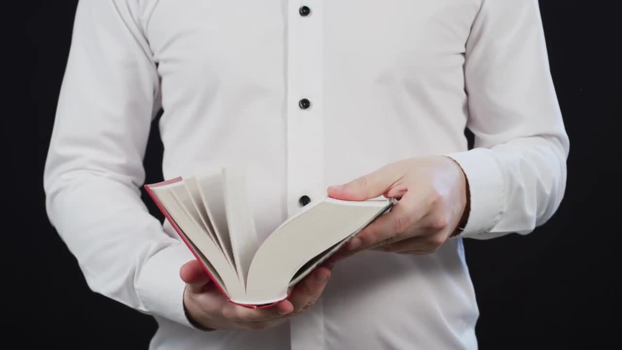 Person Browsing Through A Book - Stock Video | Motion Array