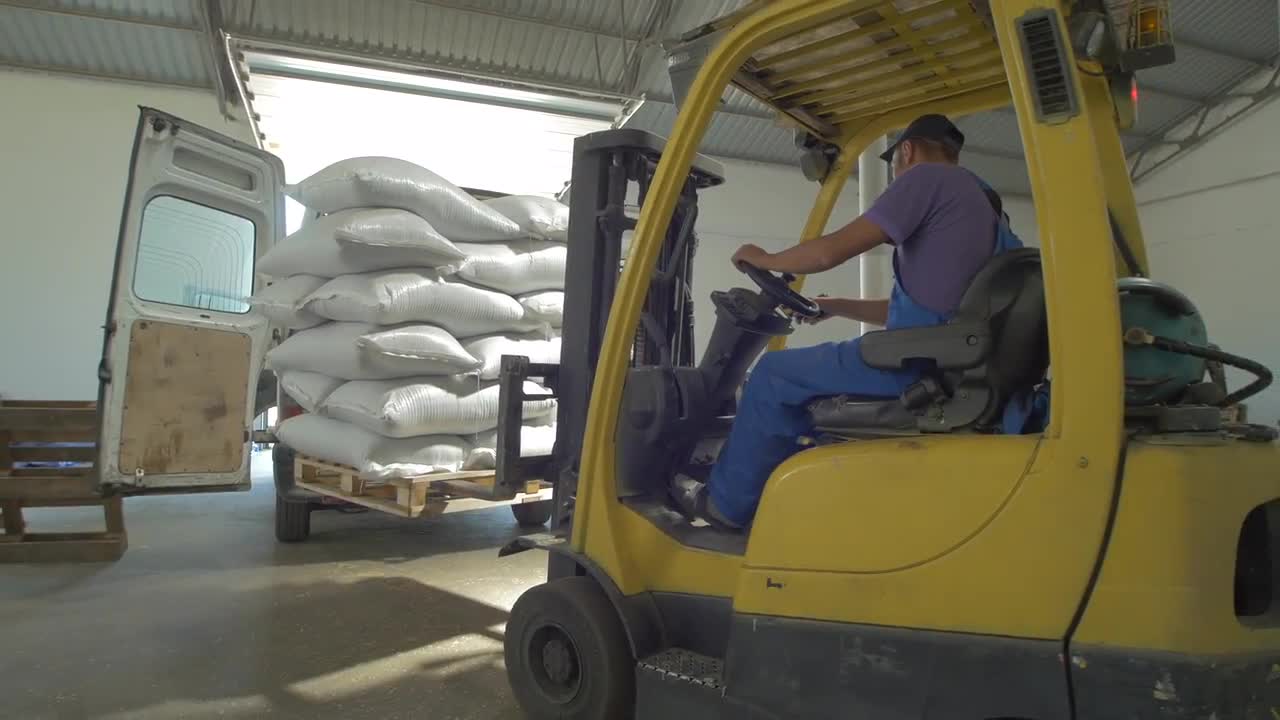 Forklift Loading A Van - Stock Video | Motion Array