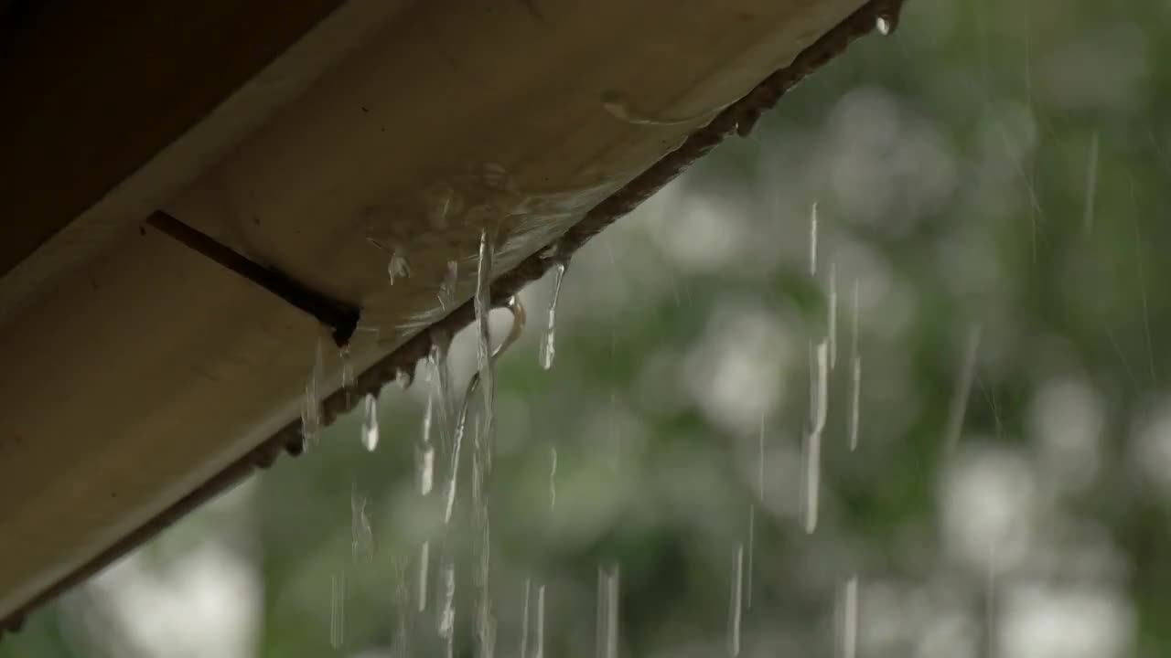 Water Dripping From An Eave - Stock Video | Motion Array
