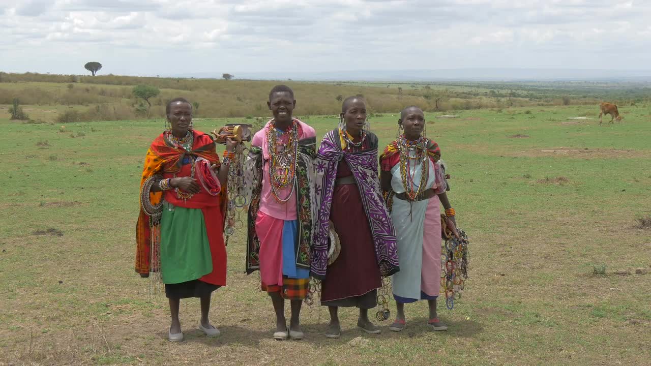 Four Maasai Women With Souvenirs - Stock Video | Motion Array