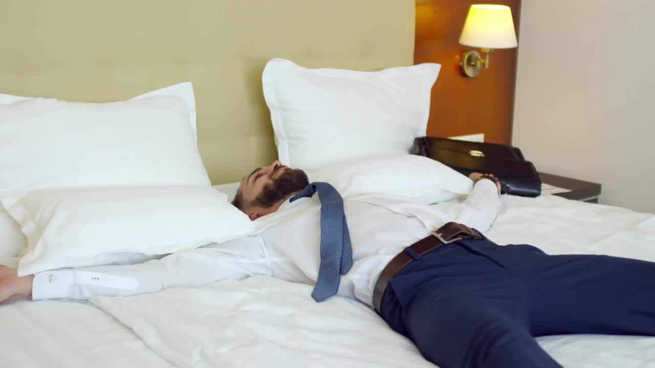 Businessman Falling Down On Bed... - Stock Video | Motion Array