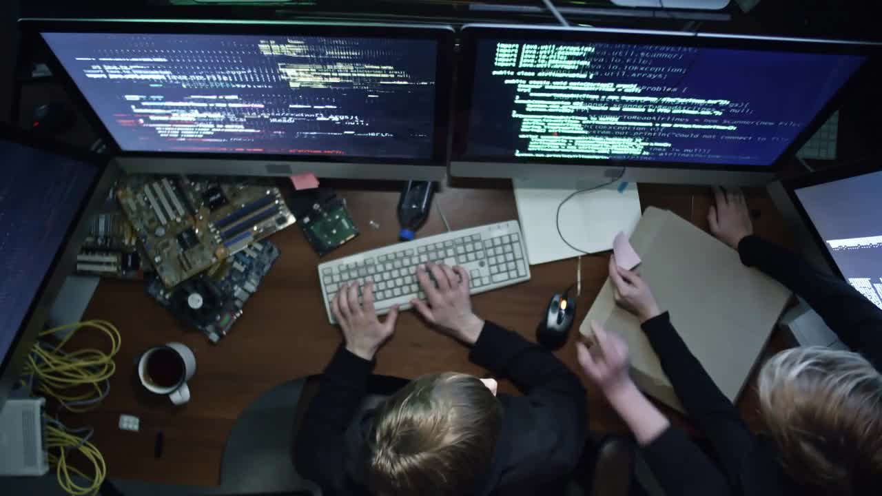Three Hackers Working With... - Stock Video | Motion Array