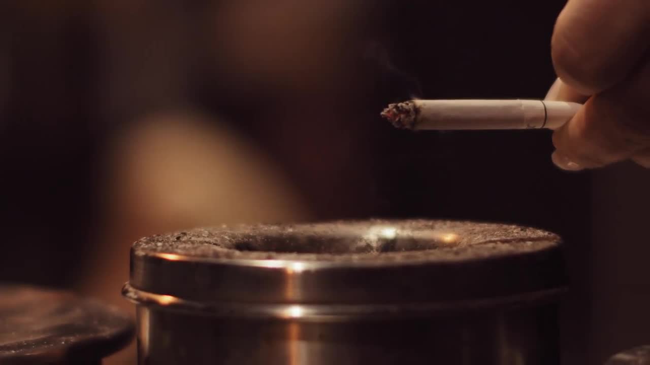 Woman Drops Ash Of A Cigarette Into... - Stock Video | Motion Array