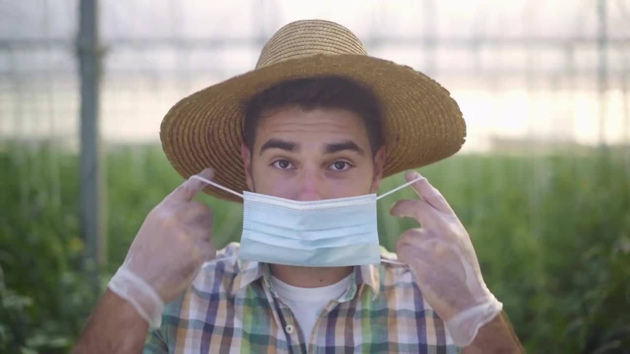 Farmer Putting On A Face Mask - Stock Video | Motion Array