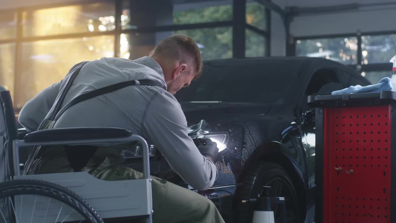 Mechanic In A Wheelchair - Stock Video | Motion Array