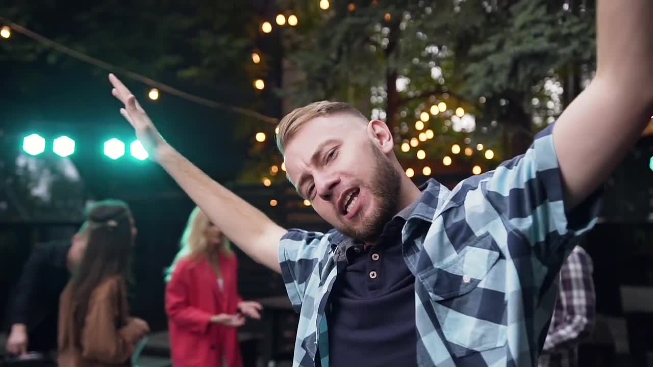 Man Dancing At Rooftop Party - Stock Video | Motion Array