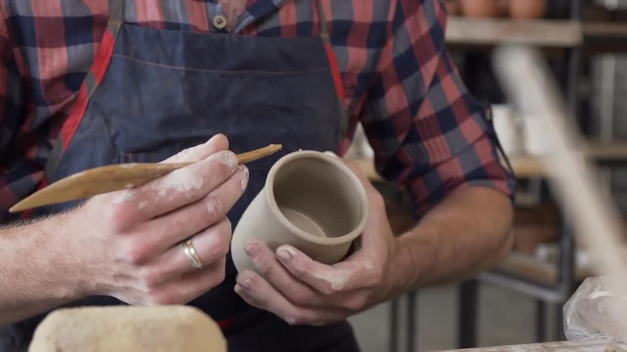 Man Working With Clay - Stock Video | Motion Array