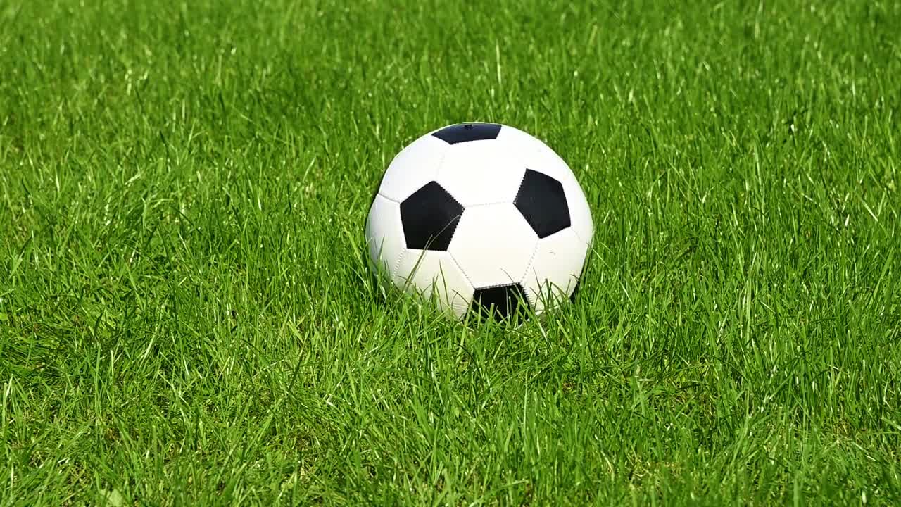 Football Bouncing On The Grass - Stock Video | Motion Array