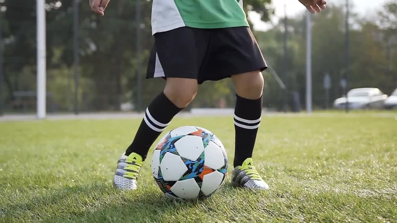 Boy's Feet Dribbling Soccer Ball - Stock Video | Motion Array