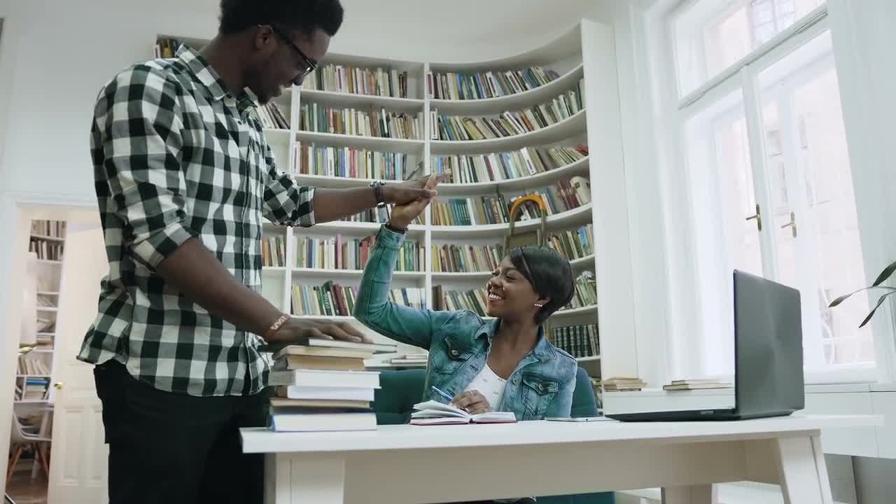 Students Greeting In Library - Stock Video | Motion Array