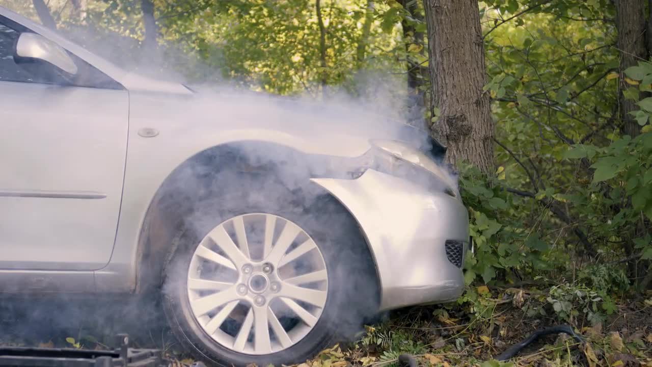 Crashed Car Emitting Smoke - Stock Video | Motion Array