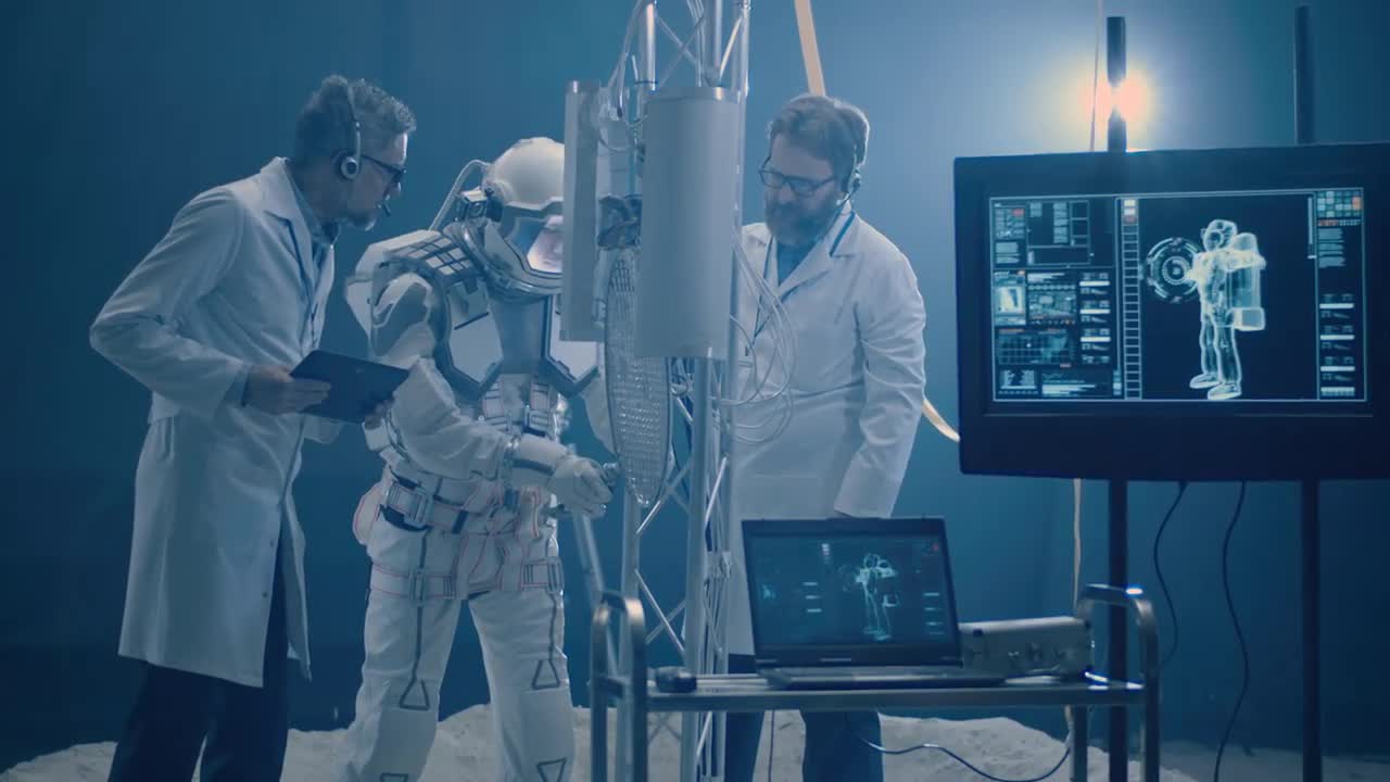 Astronaut And Scientists Running Tests - Stock Video | Motion Array