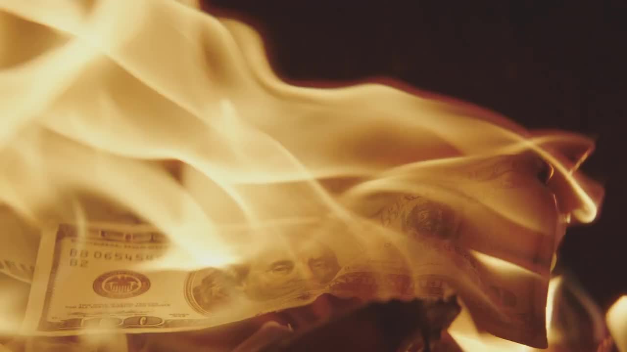 Pile Of Money On Fire - Stock Video | Motion Array