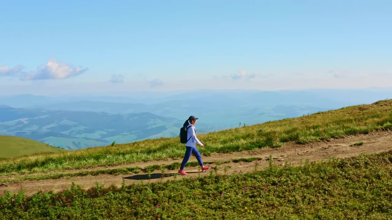 Walking A Mountain-Top Path - Stock Video | Motion Array