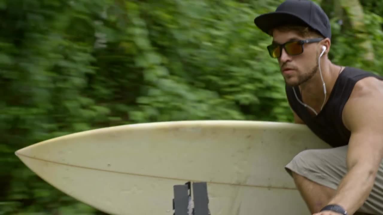 Skateboarder Skitching In Tropics - Stock Video | Motion Array