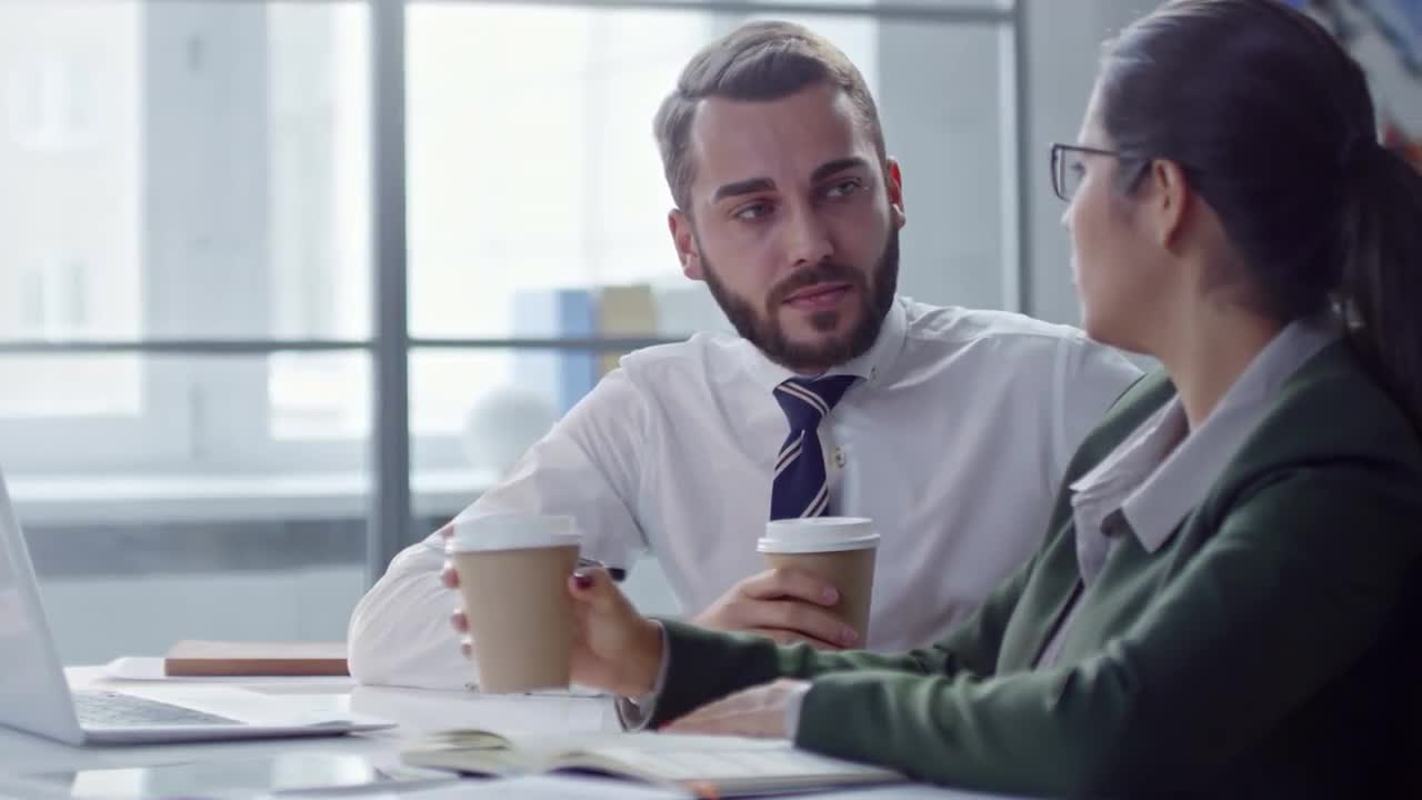 Colleagues Talking Over Coffee - Stock Video | Motion Array