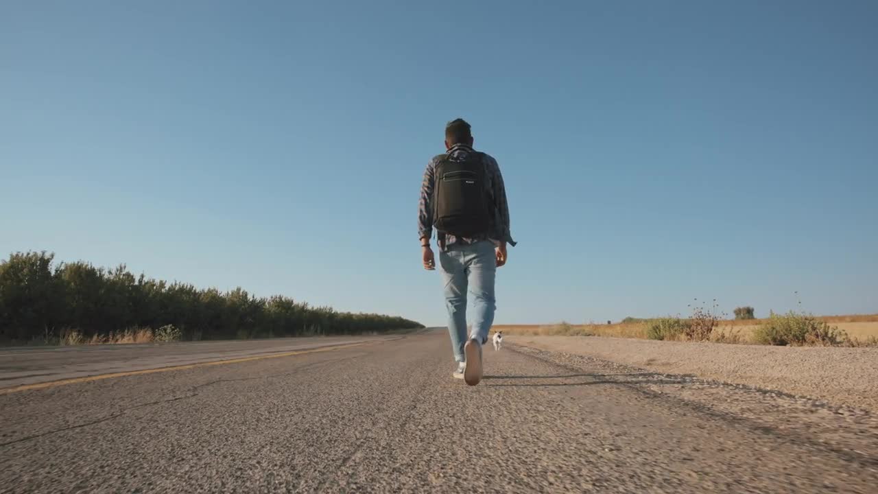 Man Walks On The Side Of A Road - Stock Video | Motion Array
