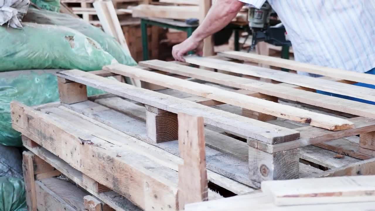 Nailing Wooden Pallets Together - Stock Video | Motion Array