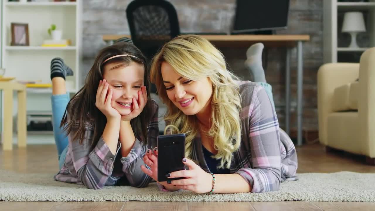 Using Smartphone With Mom - Stock Video | Motion Array