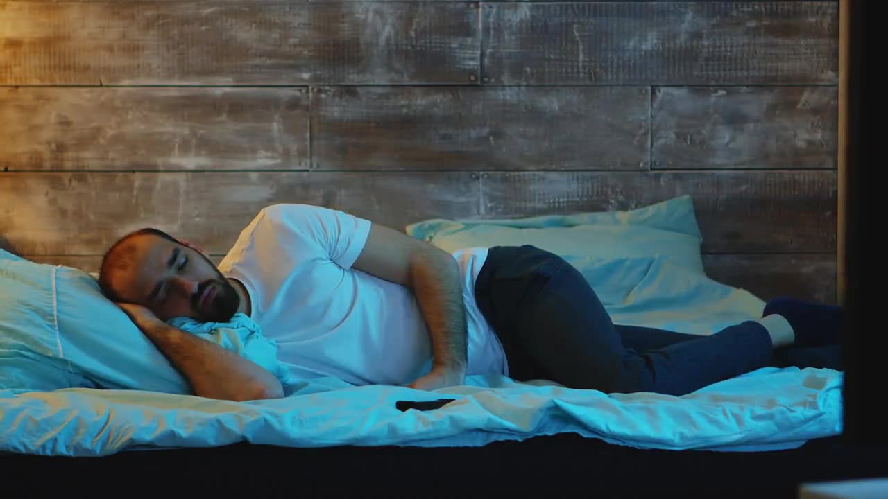 Man Falling Asleep While Watching TV - Stock Video | Motion Array