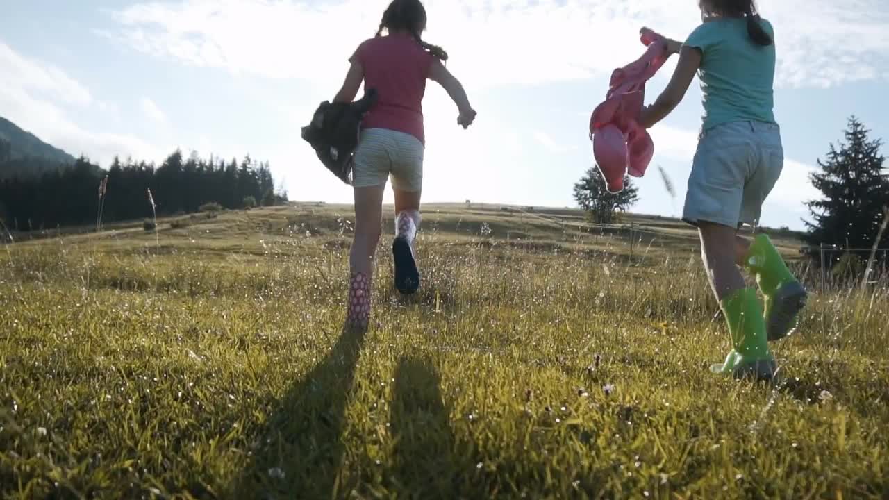 Kids Running On Wet Grass - Stock Video | Motion Array