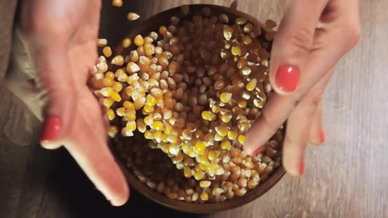 Dropping Popcorn Into A Bowl - Stock Video | Motion Array