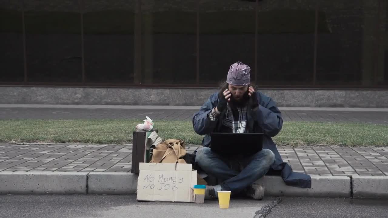 Homeless Man On Laptop - Stock Video | Motion Array