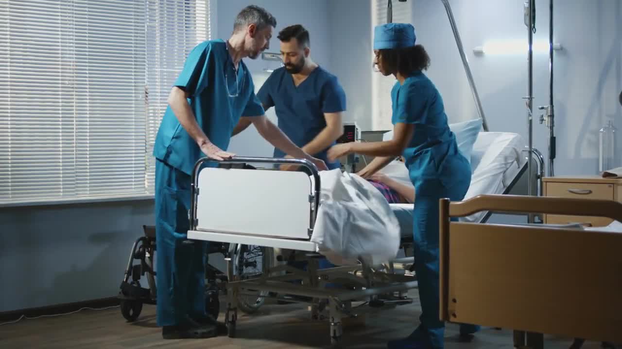 Nurses Lift Patient - Stock Video | Motion Array