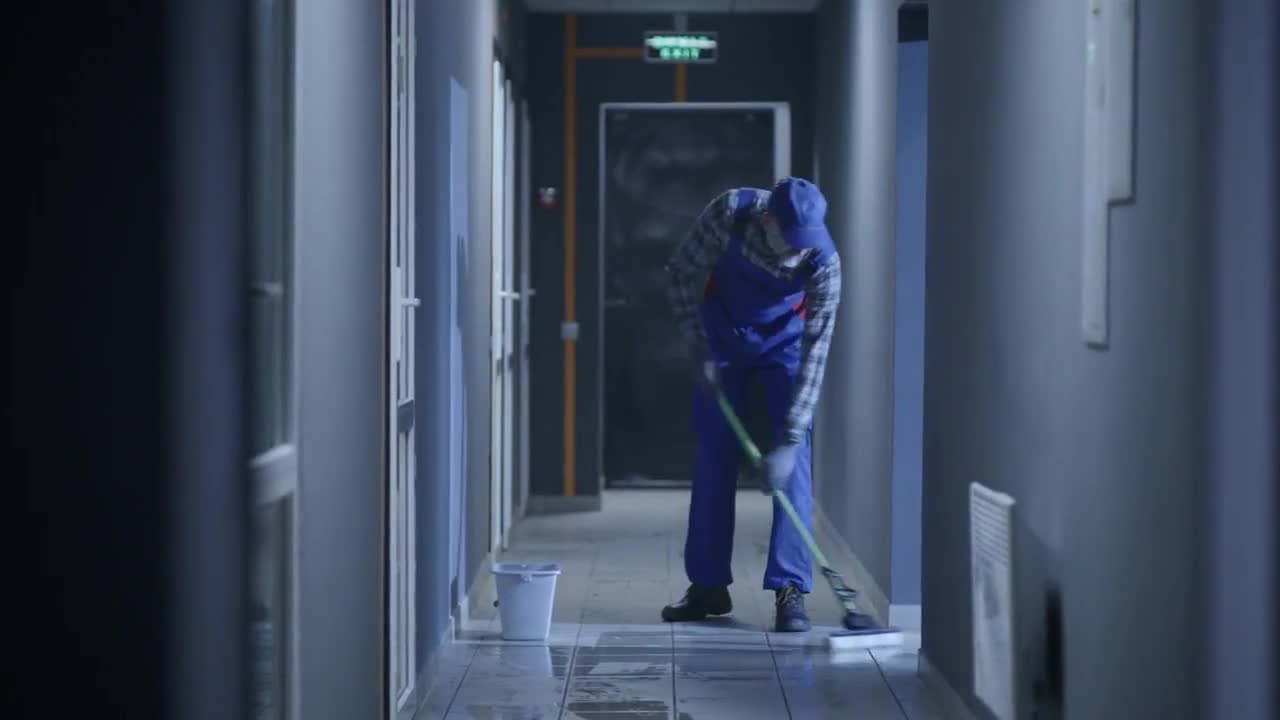 Janitor Cleaning A Hallway - Stock Video | Motion Array