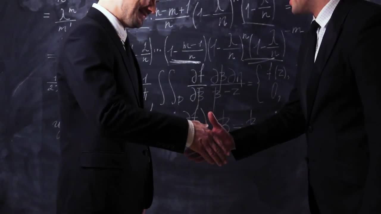 Two Scientists Shake Hands - Stock Video | Motion Array