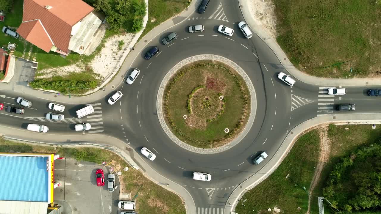 Cars Cruise Roundabout Top View - Stock Video | Motion Array