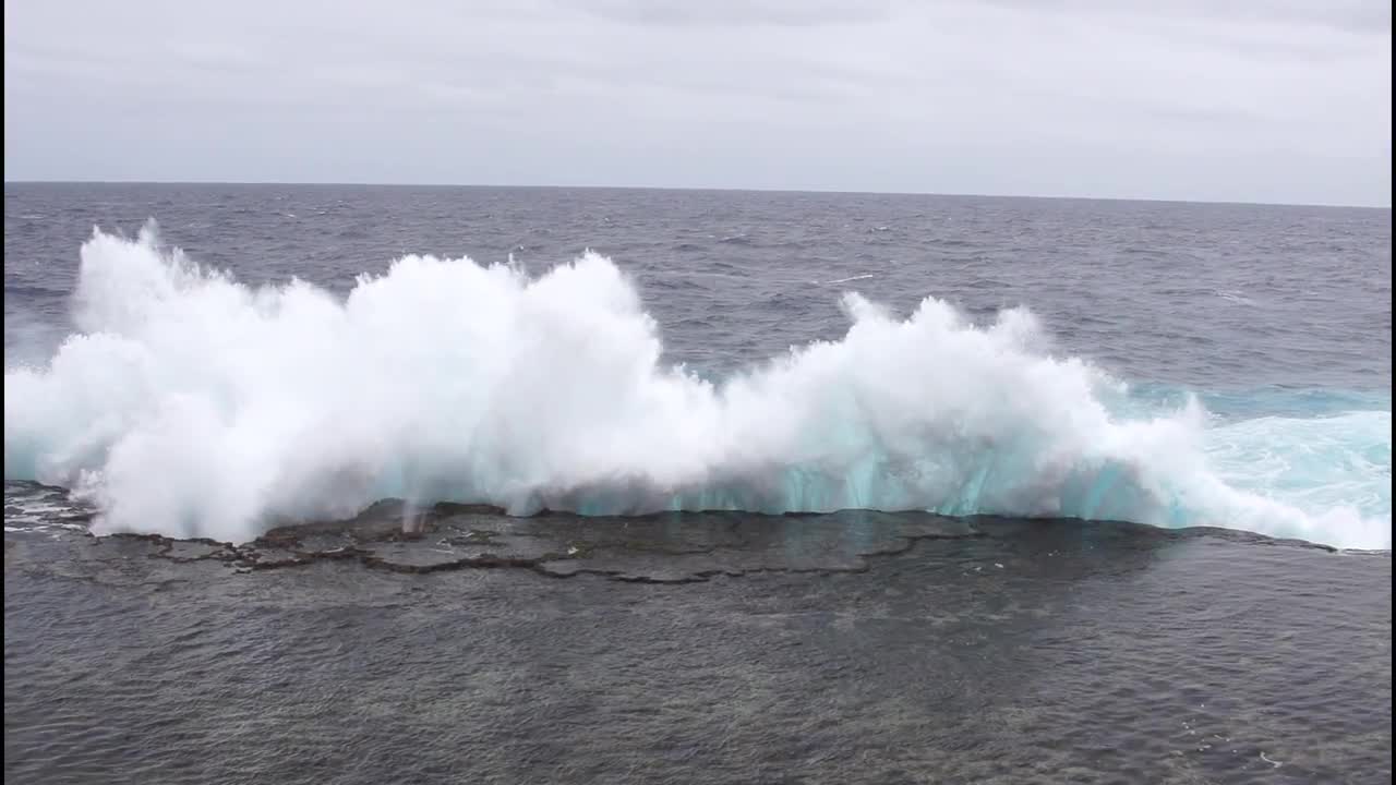 Wave Crashing Into A Cliff - Stock Video | Motion Array