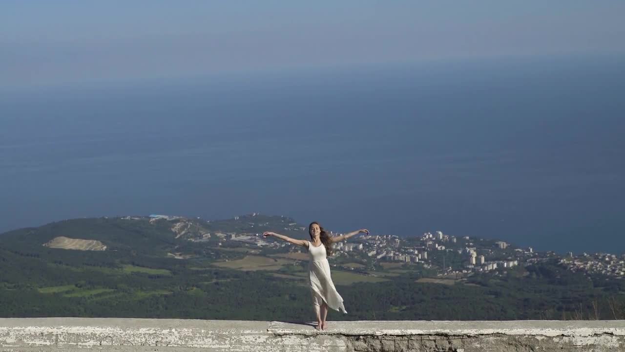 Standing On Stone Ledge - Stock Video | Motion Array