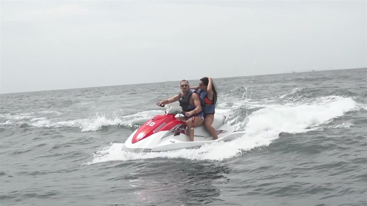 Couple Ride Jet Ski - Stock Video | Motion Array