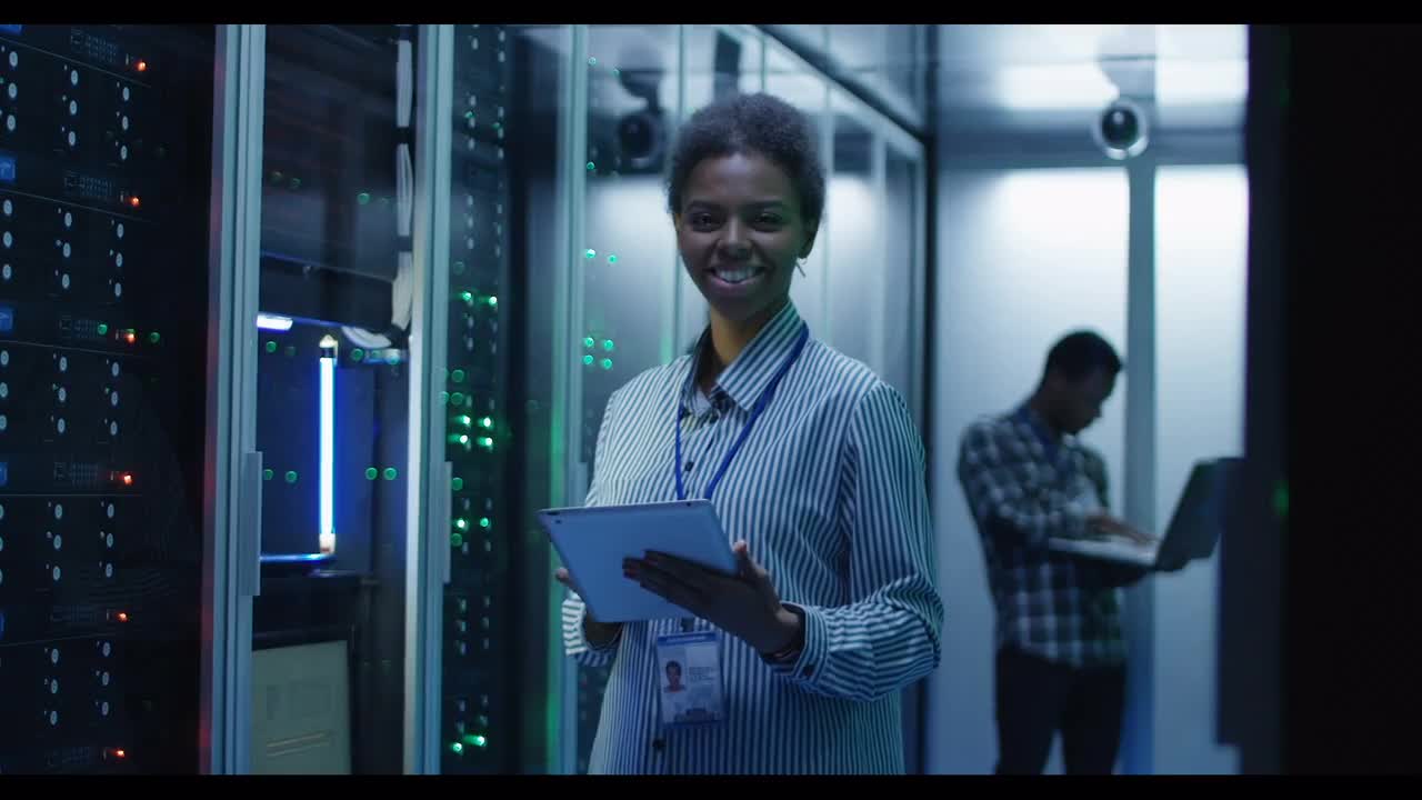 Smiling Woman In Data Center - Stock Video | Motion Array