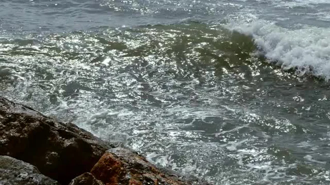 Waves Crashing Into Wave Breaker - Stock Video | Motion Array