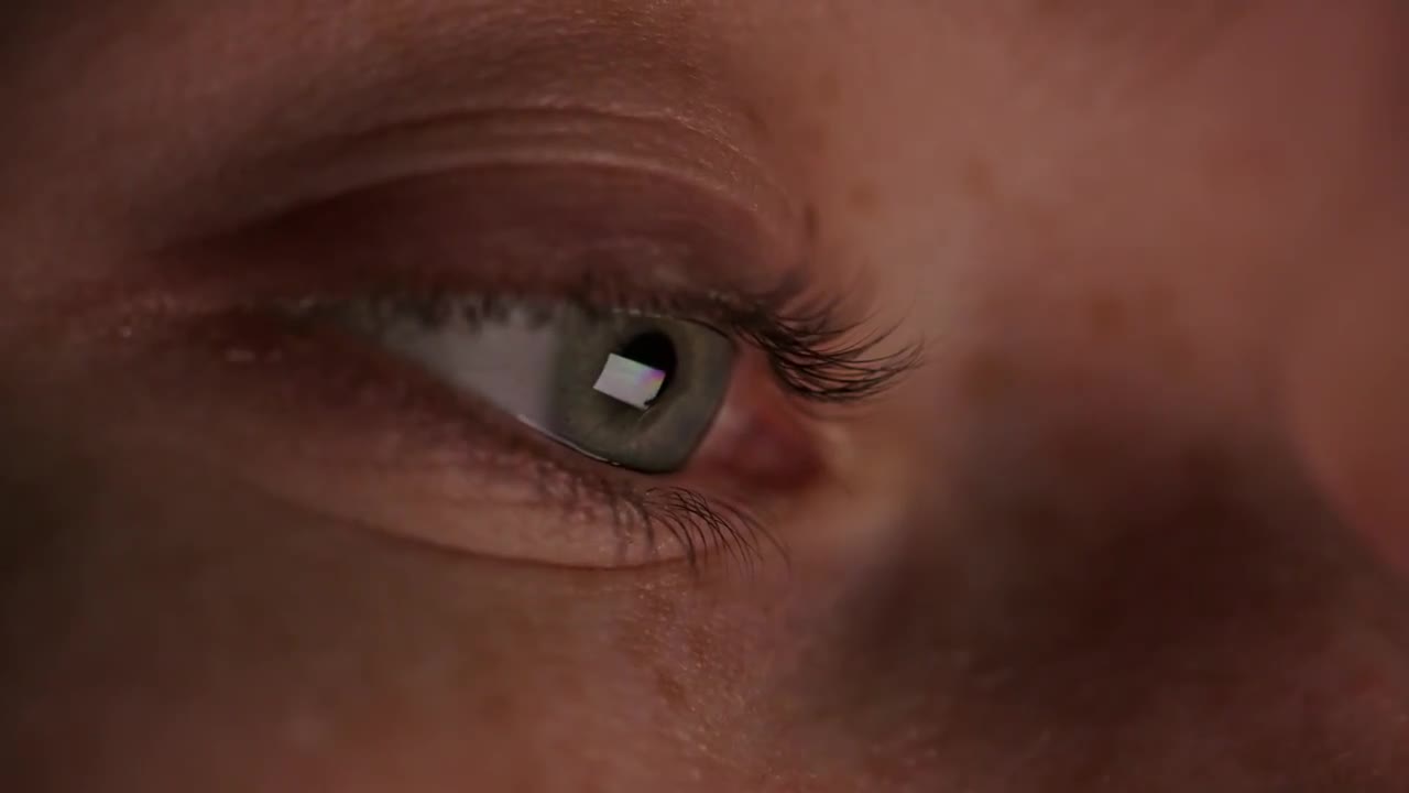 Phone Screen Reflecting On Woman's Eye - Stock Video | Motion Array