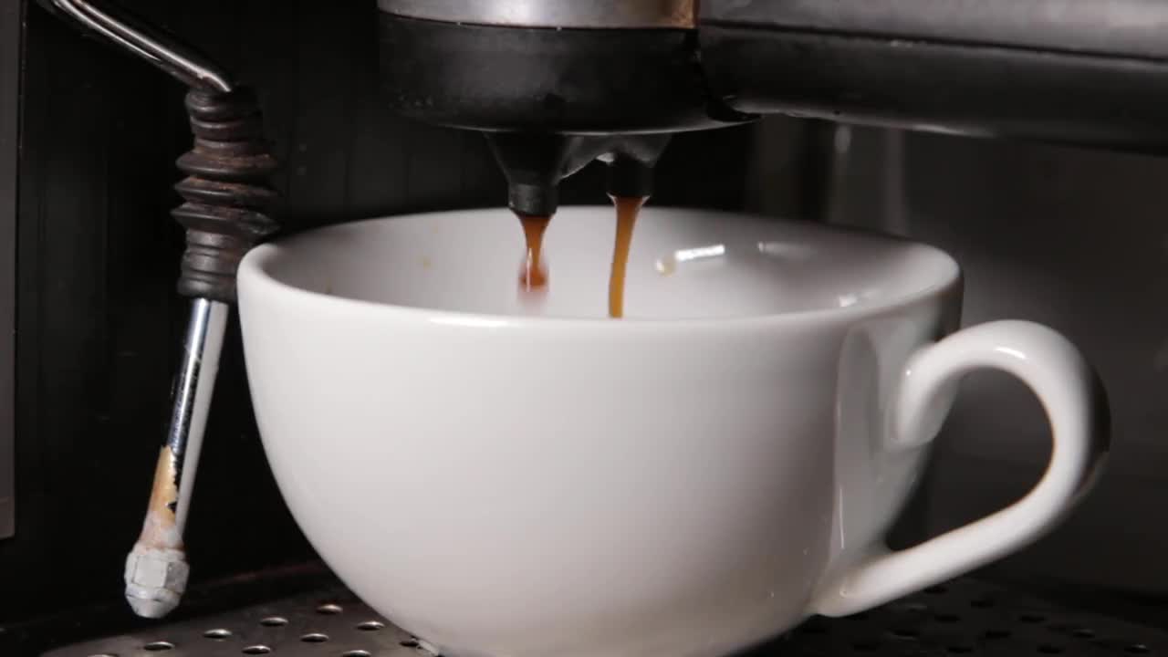 Fresh Coffee Dropping Into Cup - Stock Video | Motion Array