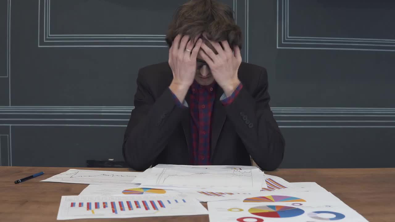 Overworked Young Male Employee - Stock Video | Motion Array