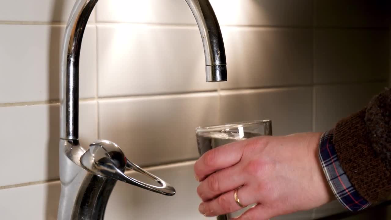 Man Getting Water From A Faucet - Stock Video | Motion Array